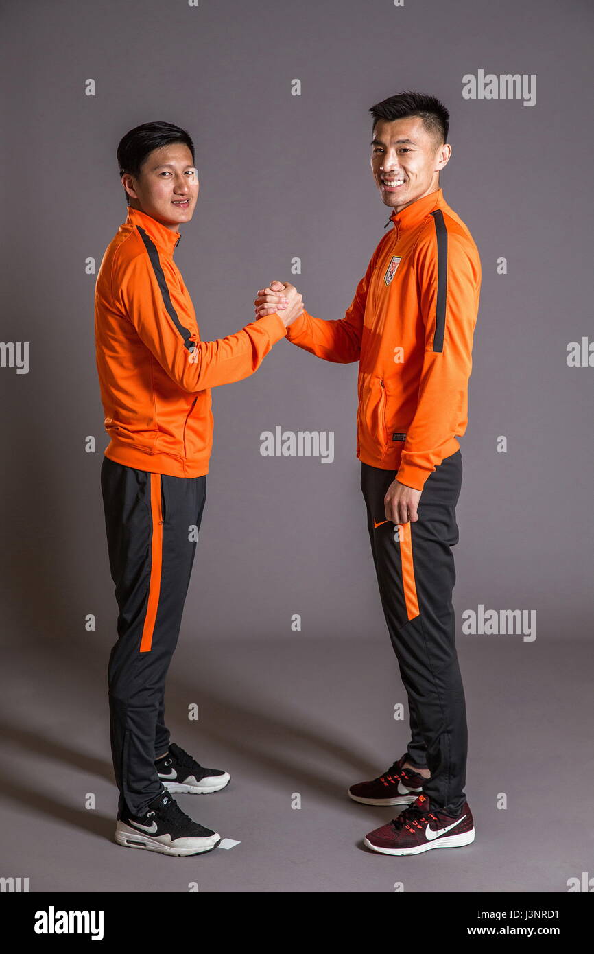Portrait of Chinese soccer players Jiang Jiajun, left, and Zheng Zheng of Shandong Luneng ...