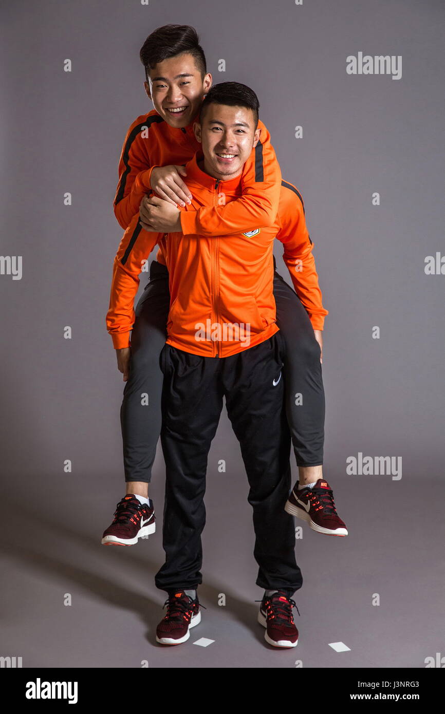 Portrait of Chinese soccer players Cheng Yuan, front, and Li Hailong of ...