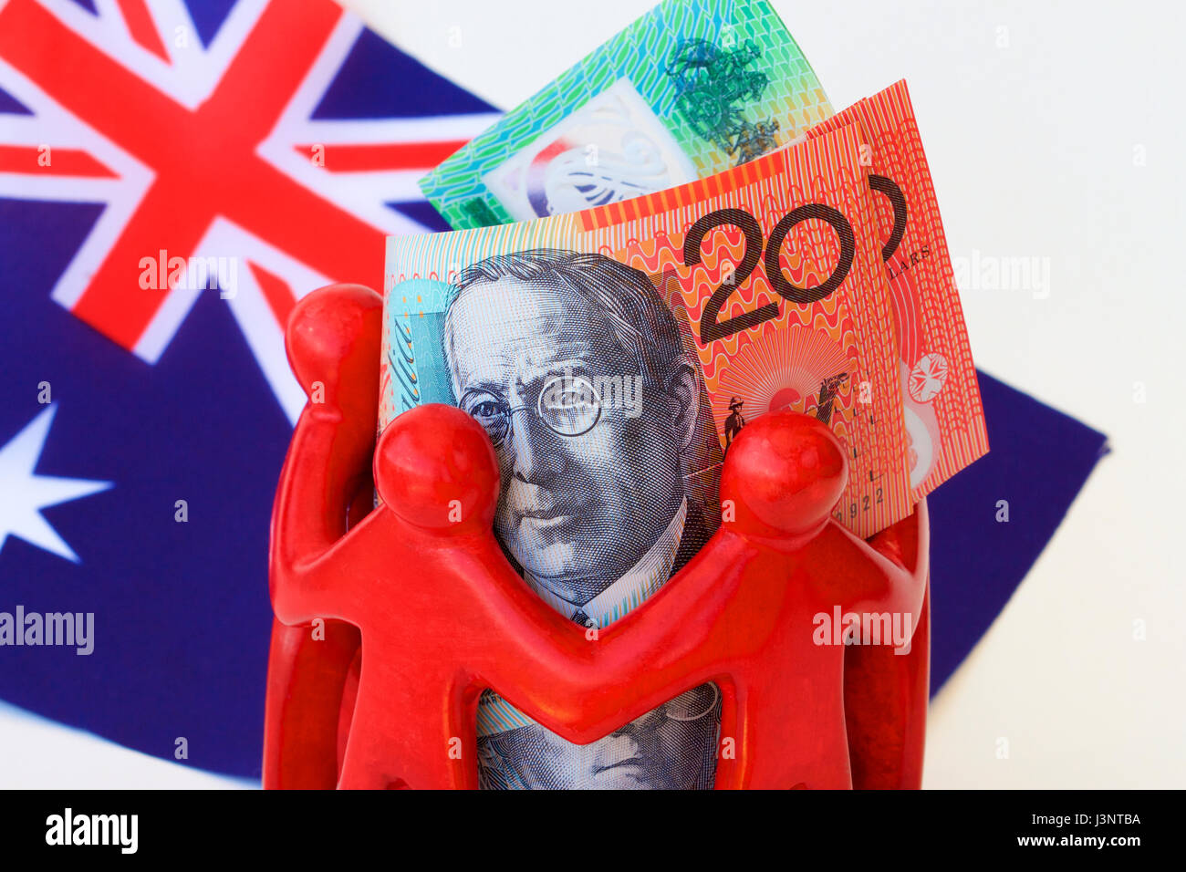 Australian money gathered with the Australian flag Stock Photo - Alamy