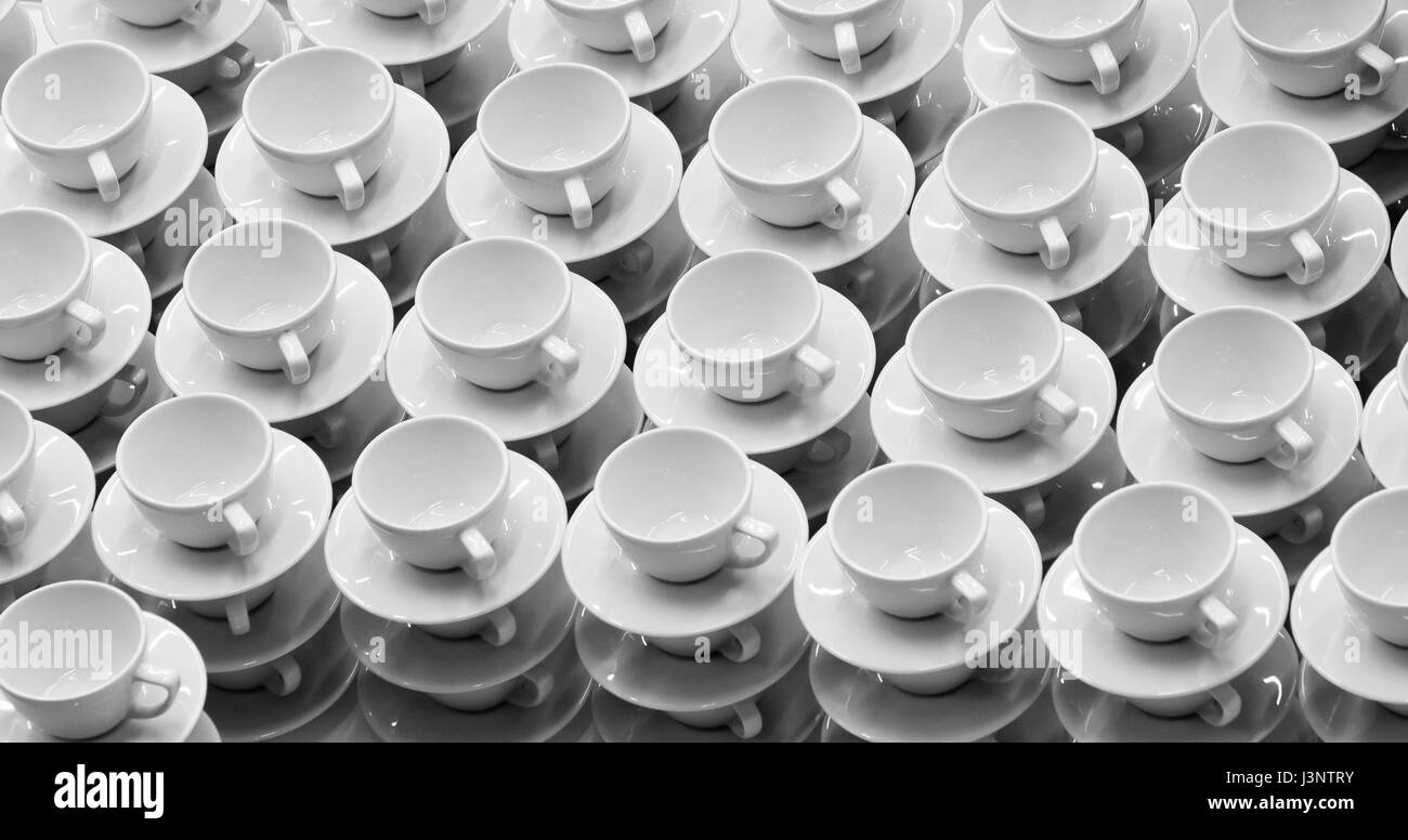 Many empty white ceramic cups top view Stock Photo - Alamy