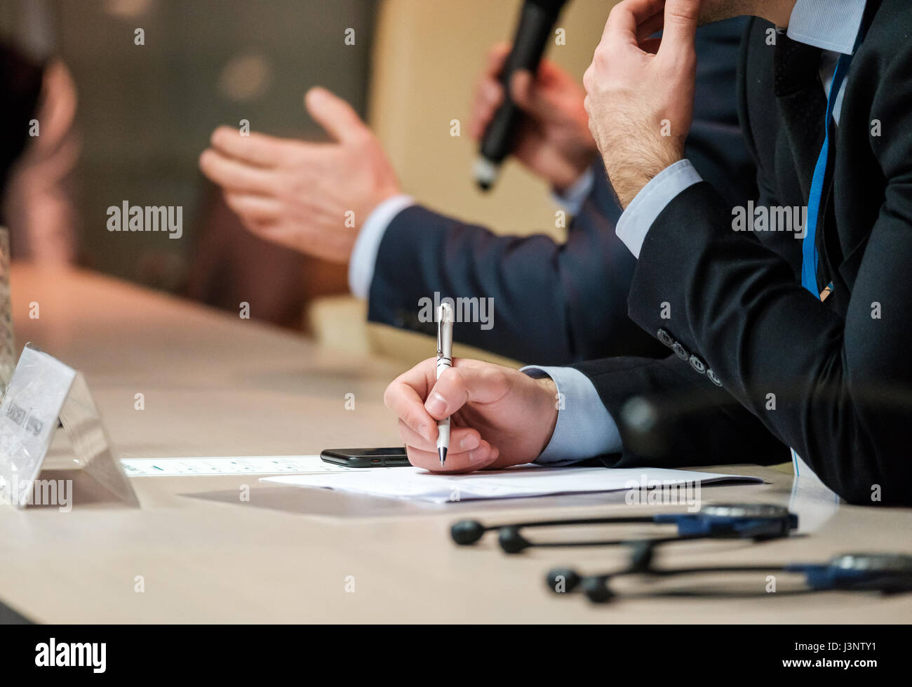 Business people details at the conference Stock Photo - Alamy