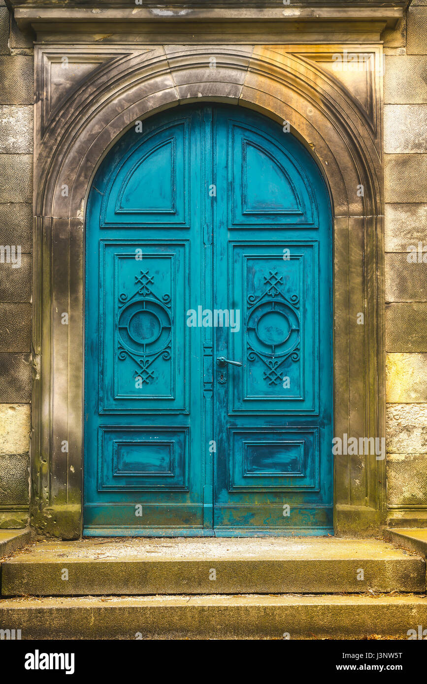 old turquoise metal gate of an old tomb Stock Photo - Alamy