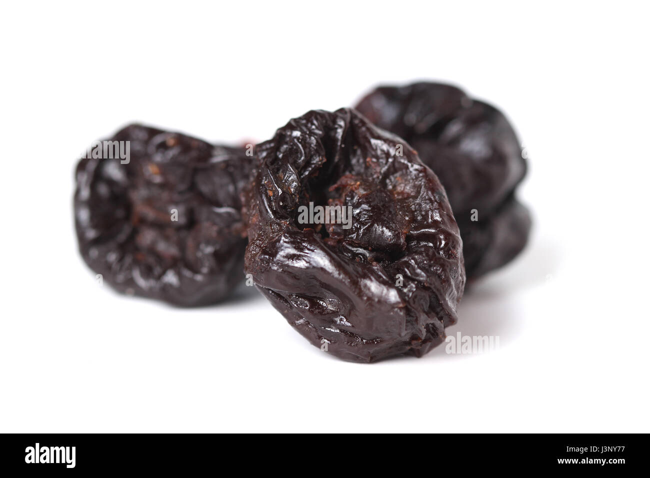 Dried prunes close up Cut Out Stock Images & Pictures - Alamy