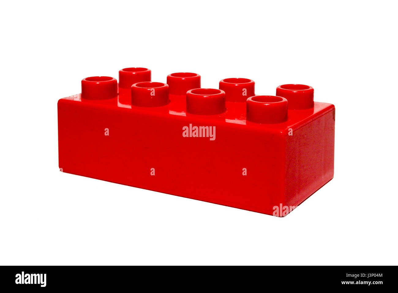 Children's coloured plastic toy building block isolated on a white ...