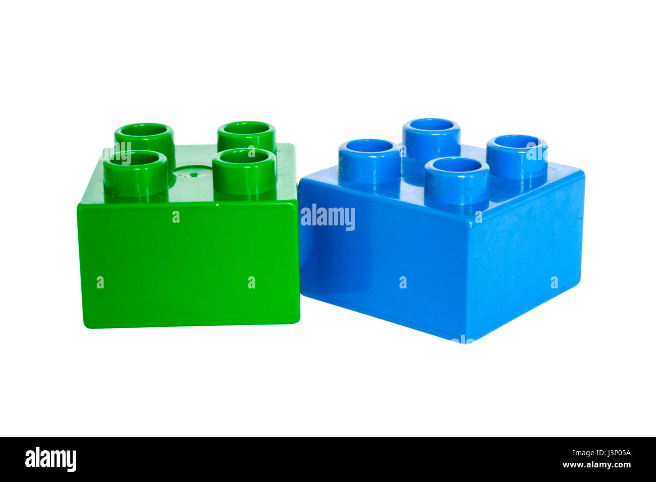 Children's coloured plastic toy building blocks isolated on a white ...