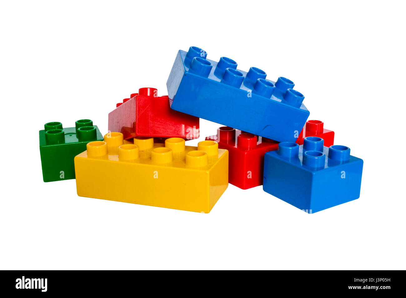 Children's coloured plastic toy building blocks isolated on a white ...