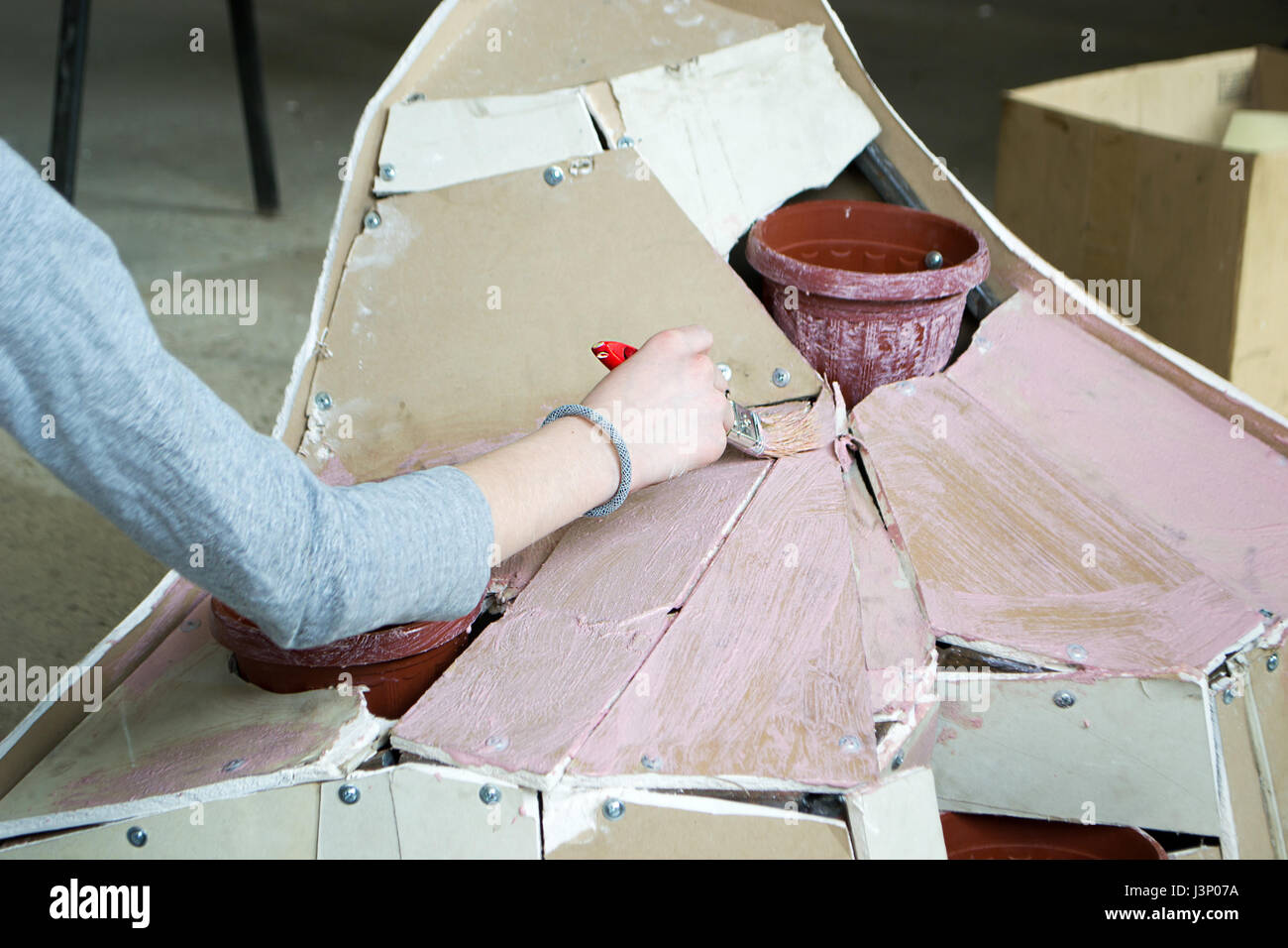 A sculptor woman prepares a mold for a bas-relief Stock Photo - Alamy