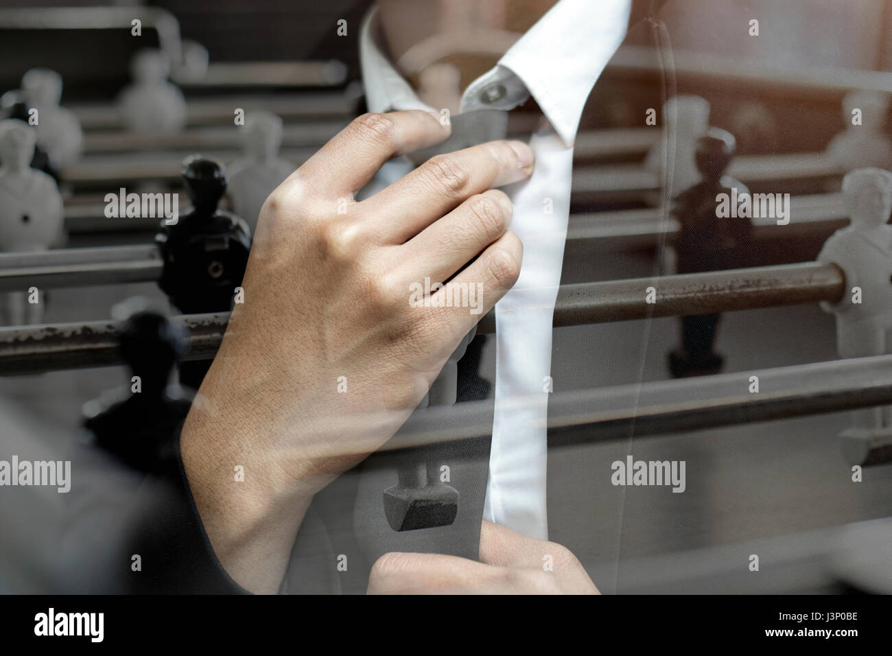 young business man adjusting his neck tie Stock Photo - Alamy