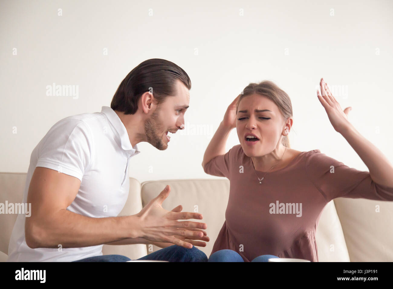 Young couple quarrelling, shouting and blaming each other for pr Stock ...