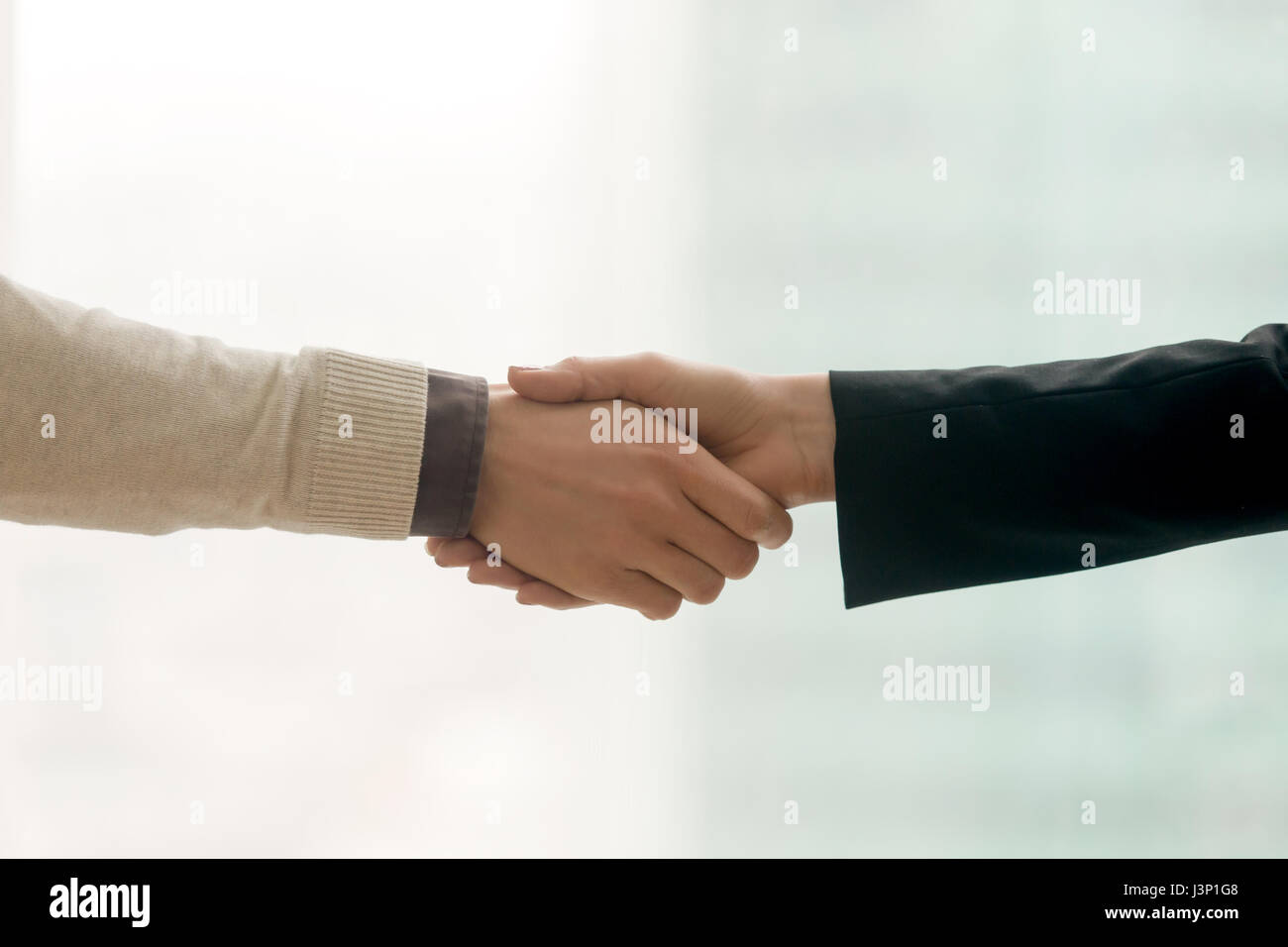 Male and female hands shaking, business handshake with copy spac Stock ...