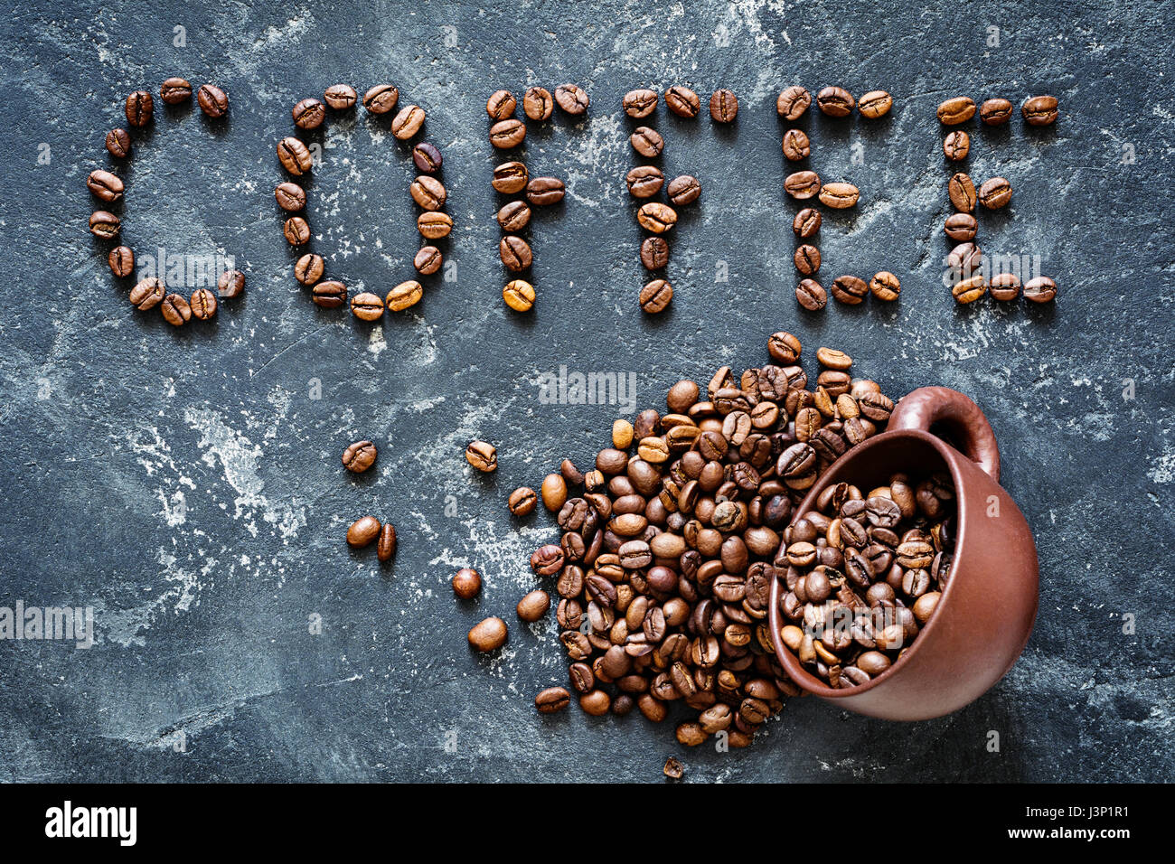 Coffee written with roasted coffee beans.Top view Stock Photo - Alamy
