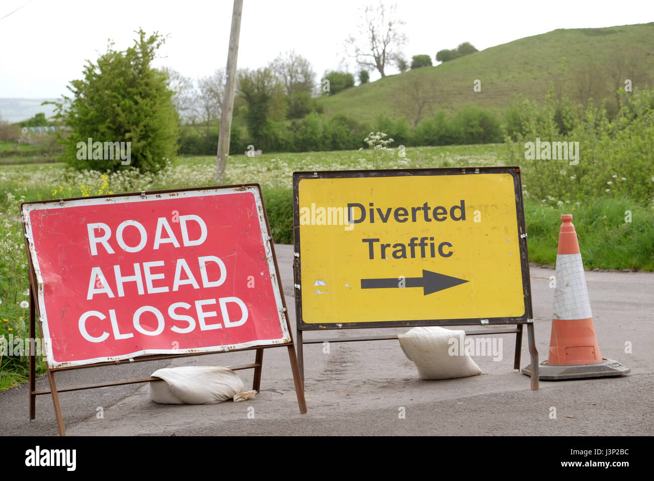 22nd April 2017 - British Road highway signs for Road closed ahead and ...