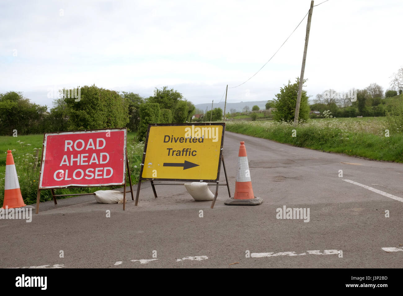 22nd April 2017 - British Road highway signs for Road closed ahead and ...