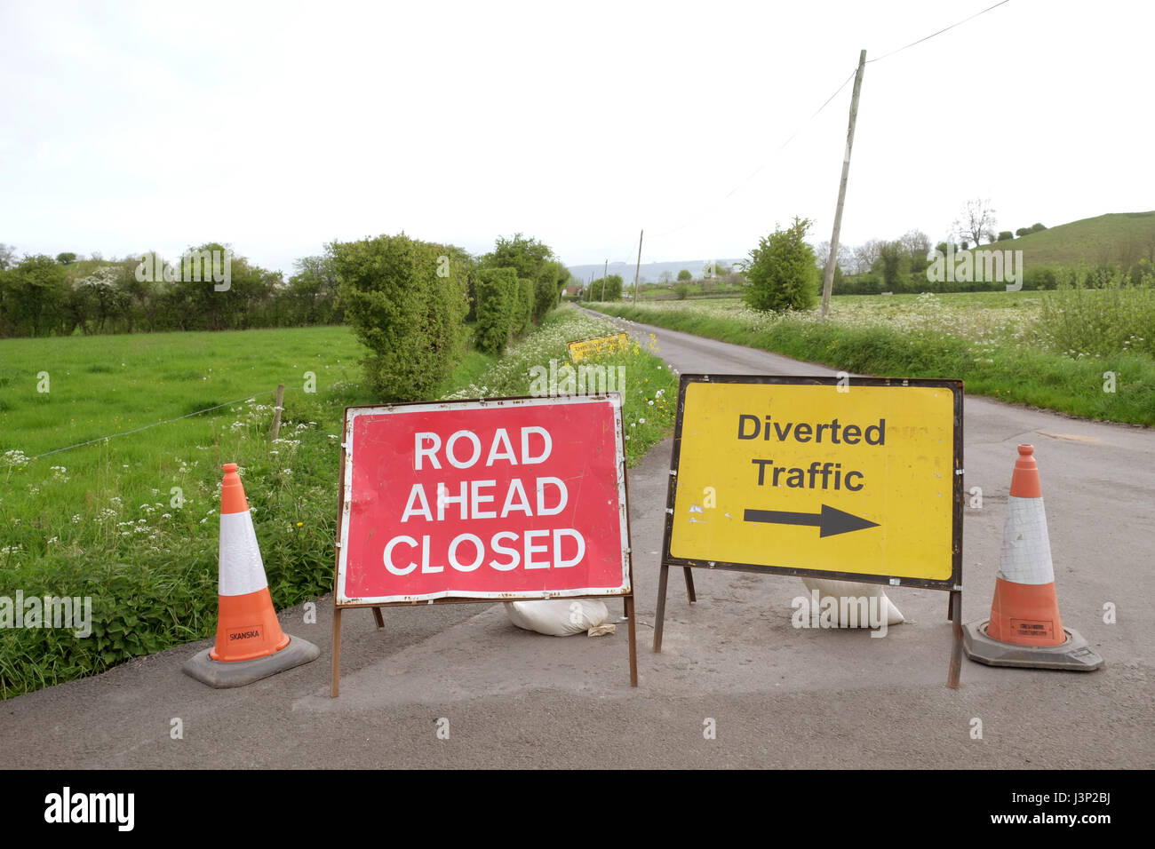 22nd April 2017 - British Road highway signs for Road closed ahead and ...