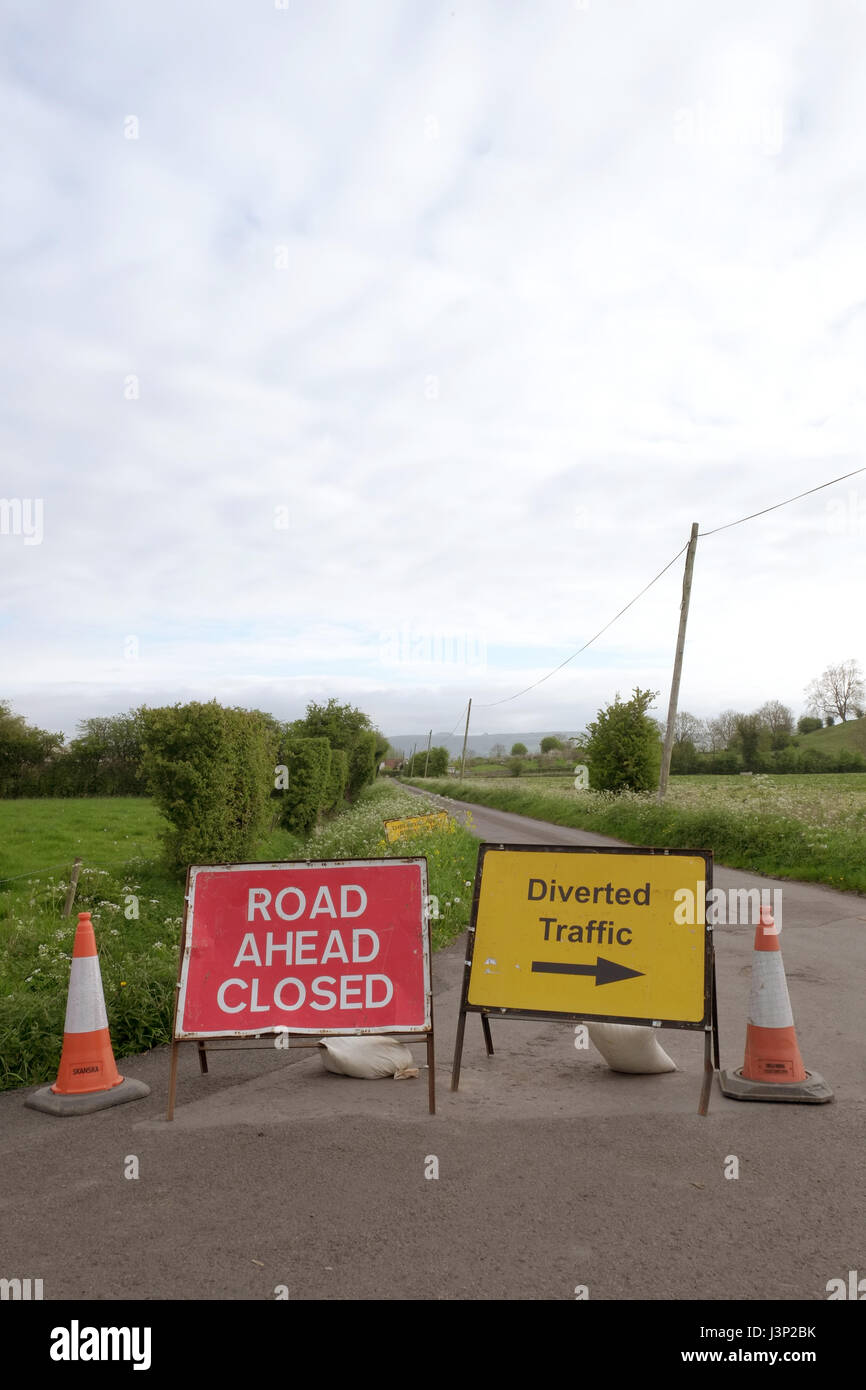 22nd April 2017 - British Road highway signs for Road closed ahead and ...