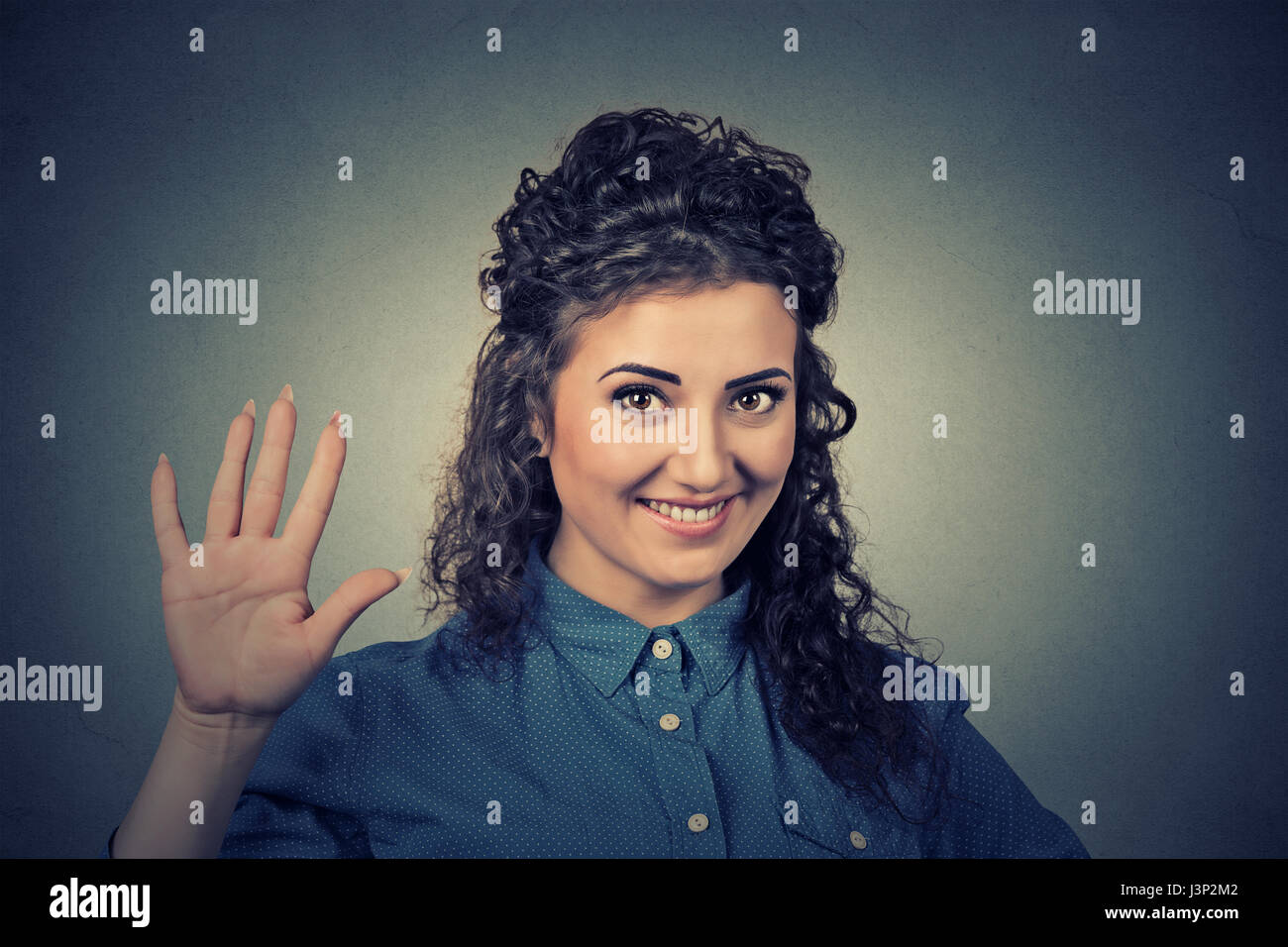 Smiling woman making high five with her hand Stock Photo - Alamy