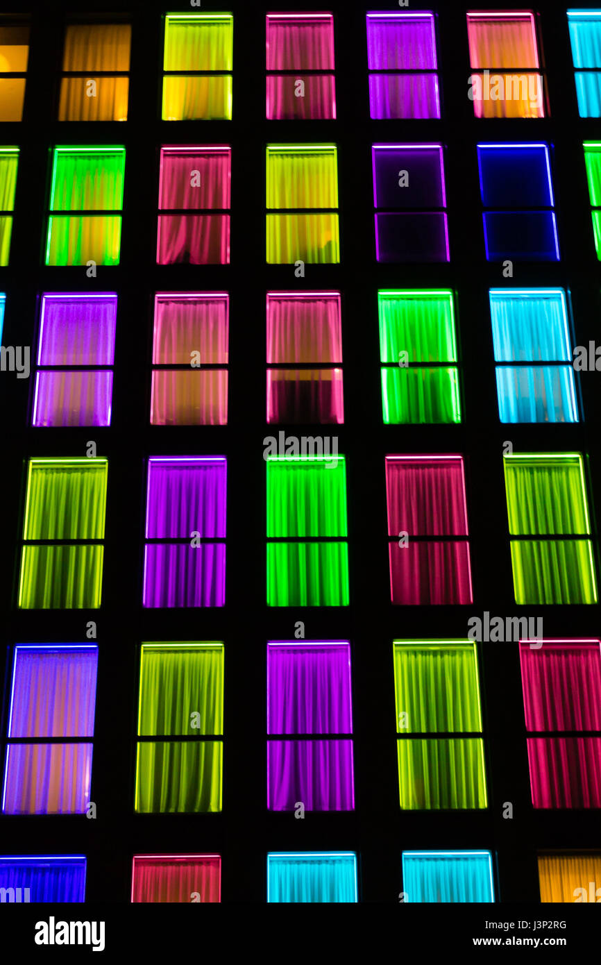 Colored windows texture. Windows illuminated by neon lights background ...