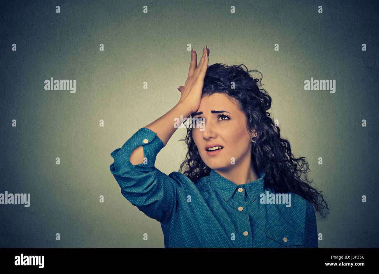 Regrets wrong doing. Closeup portrait silly young woman, slapping hand ...