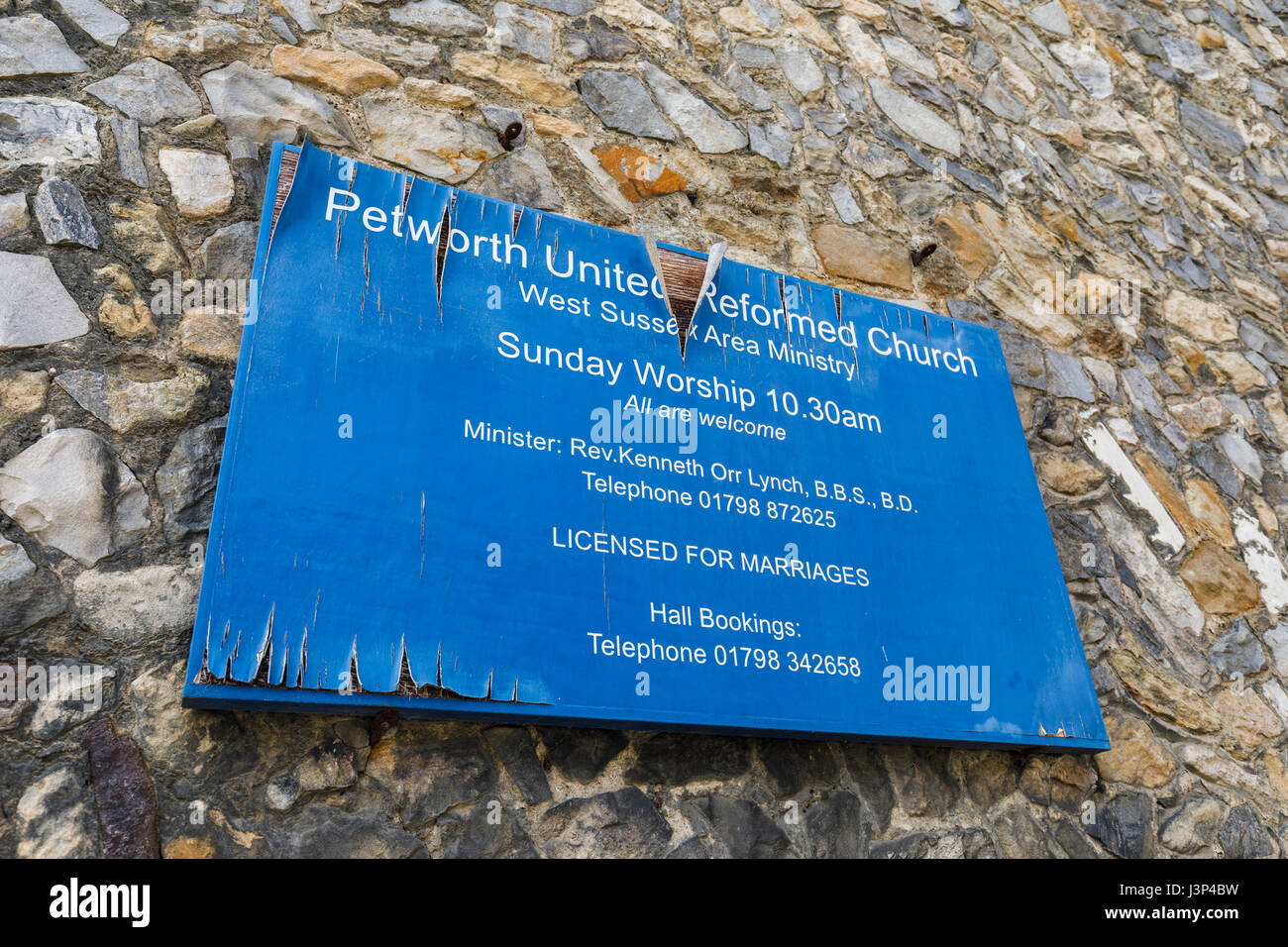 Neglected dilapidated name sign on exterior of Petworth United Reformed ...