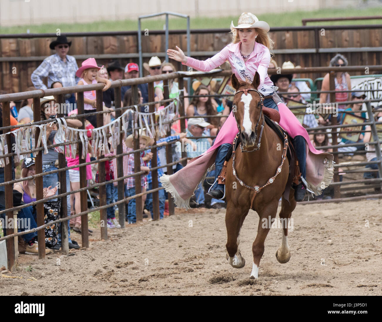 Rodeo cowgirls make an entrance at the Cottonwood Rodeo in northern ...