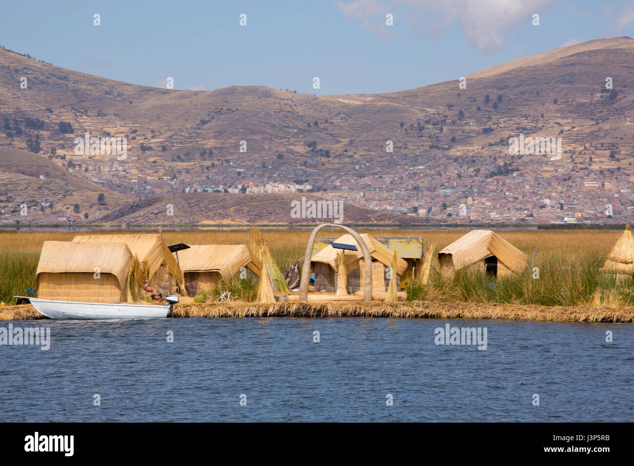 Los Uros artificial islands on Lake Titicaca, made of floating reeds ...
