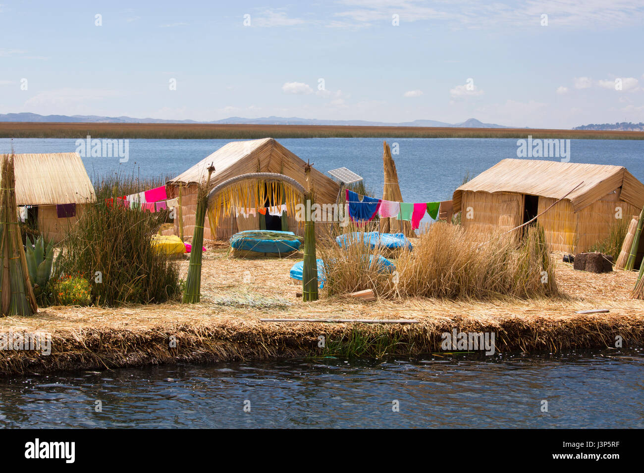 Los Uros artificial islands on Lake Titicaca, made of floating reeds ...