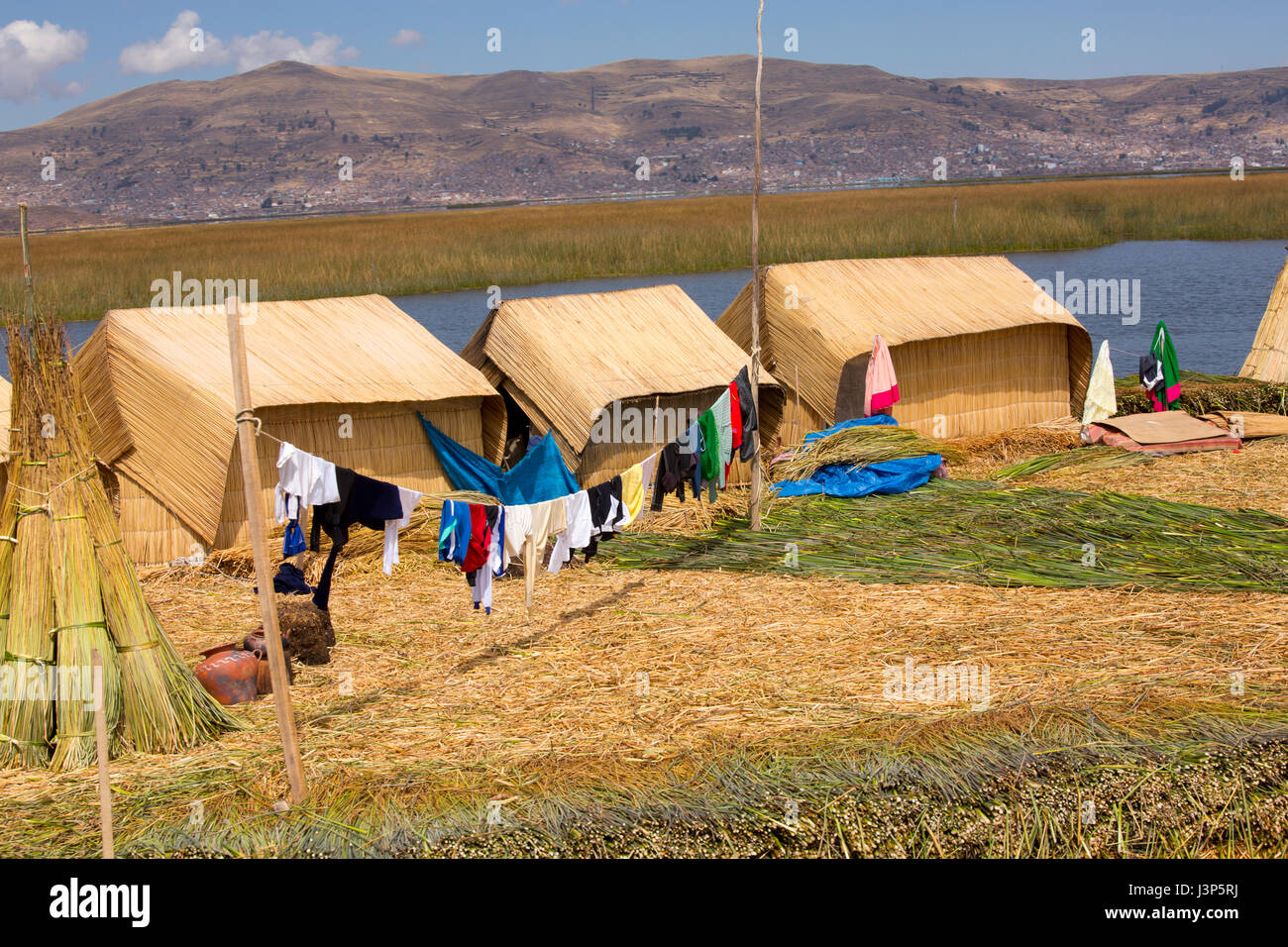 Los Uros artificial islands on Lake Titicaca, made of floating reeds ...