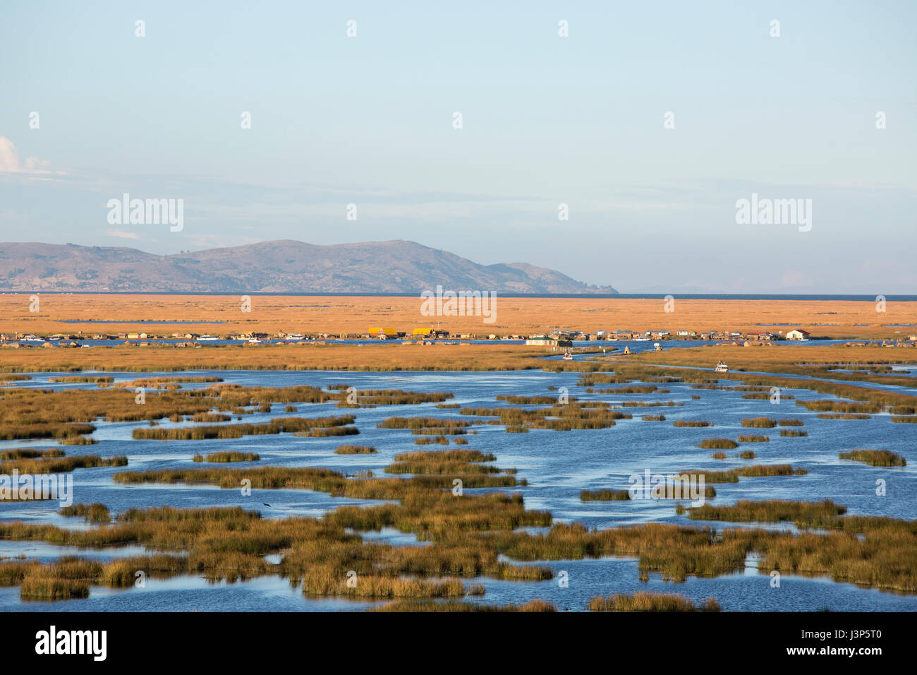 Los Uros artificial islands on Lake Titicaca, made of floating reeds ...