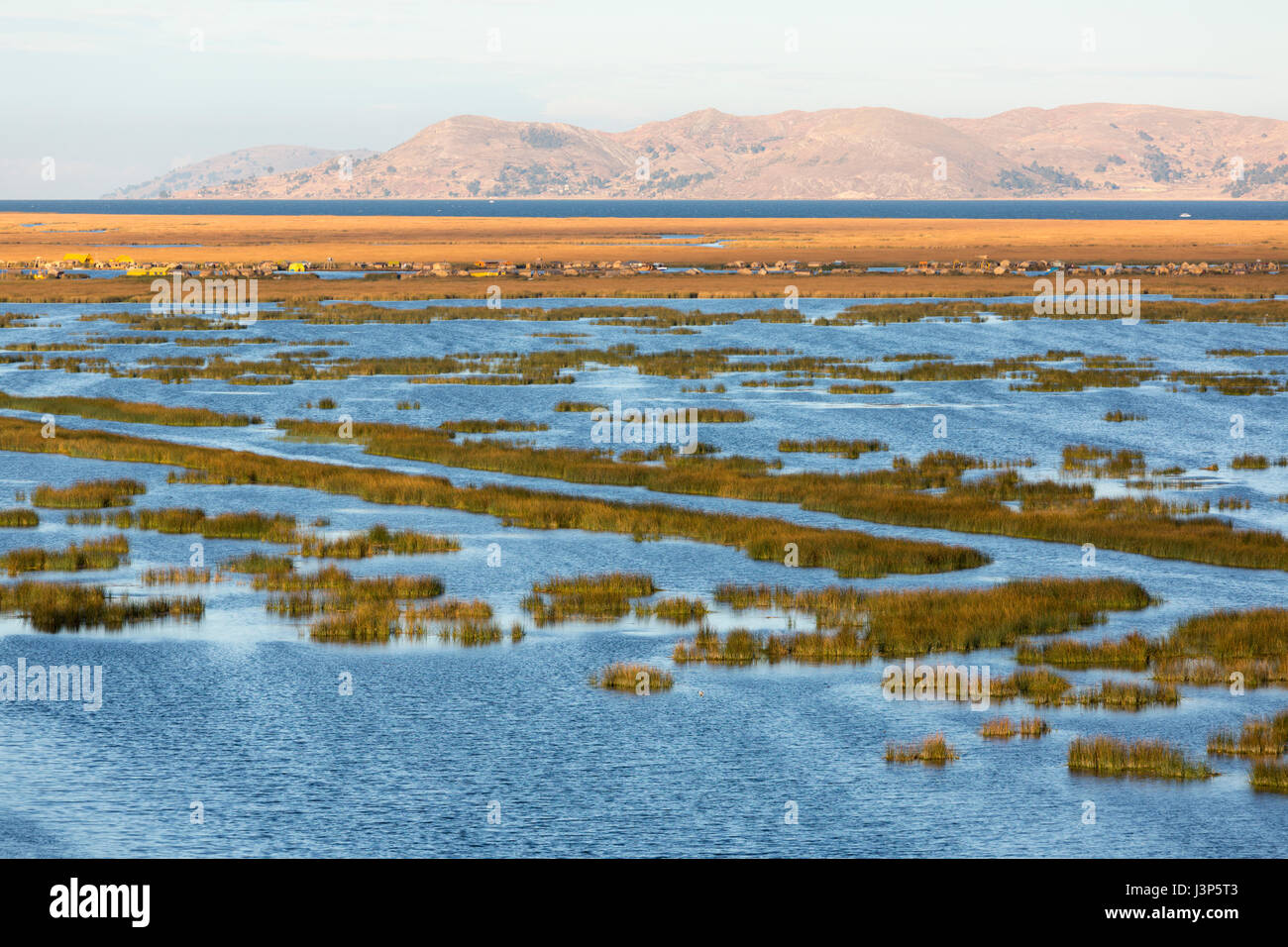 Los Uros artificial islands on Lake Titicaca, made of floating reeds ...