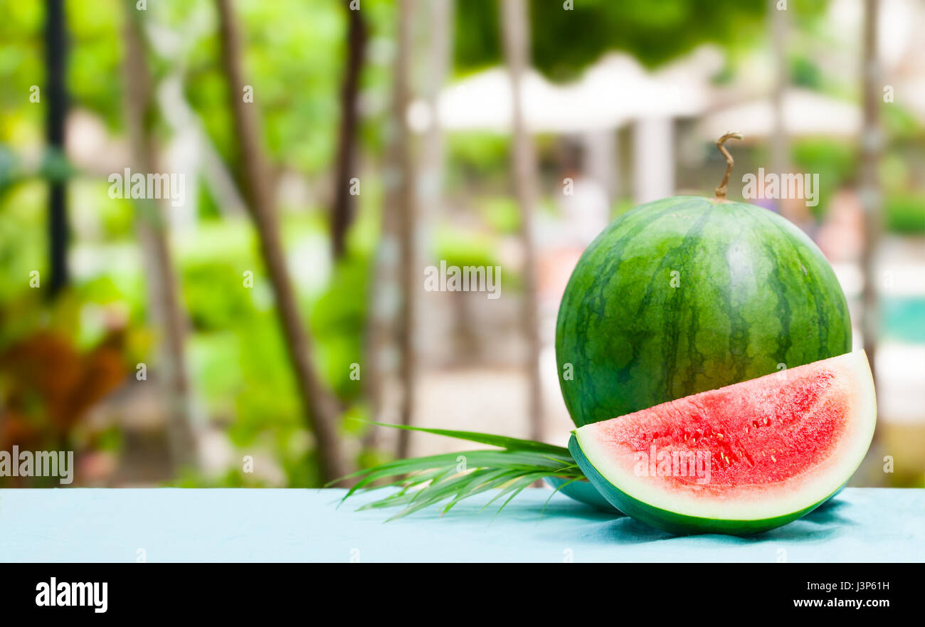 Watermelon on tropical summer background. Copy space Stock Photo - Alamy