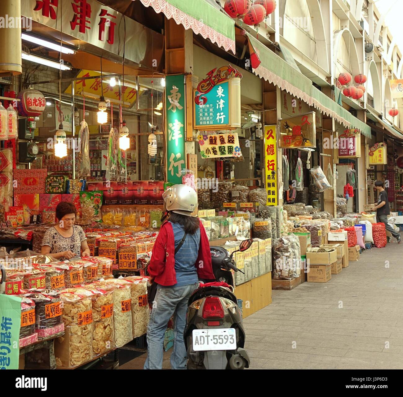 KAOHSIUNG, TAIWAN -- MAY 31, 2014: Shoppers buy goods at the famous ...