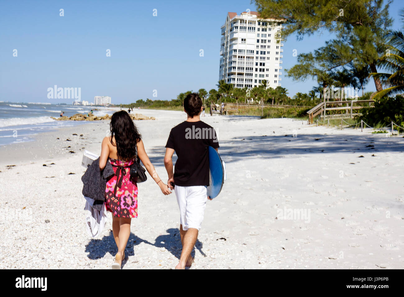 Men and women on beach in naples hi-res stock photography and images ...