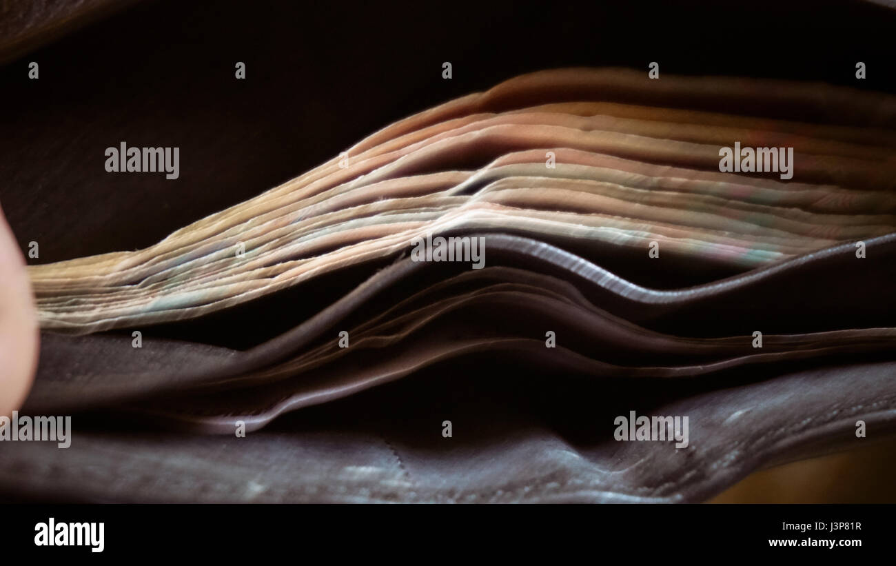 Open wallet with a little paper money Stock Photo - Alamy
