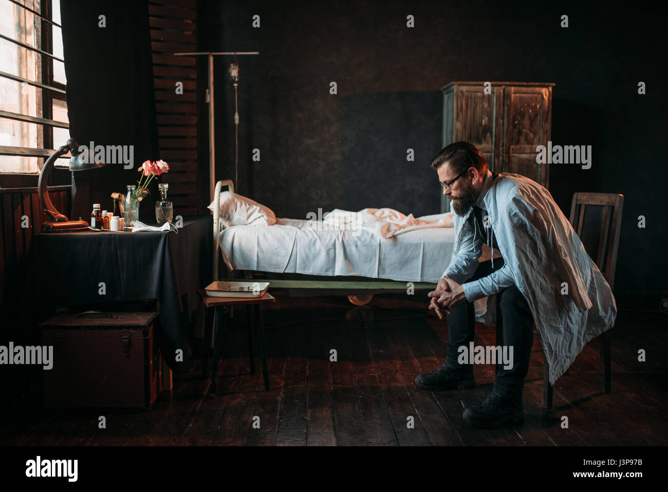 Male visitor against empty hospital bed. Death of a loved one Stock ...