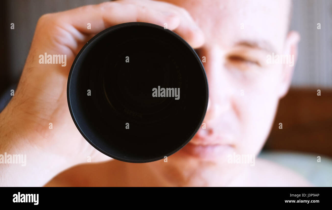 Man looking through a telescope hi-res stock photography and images - Alamy