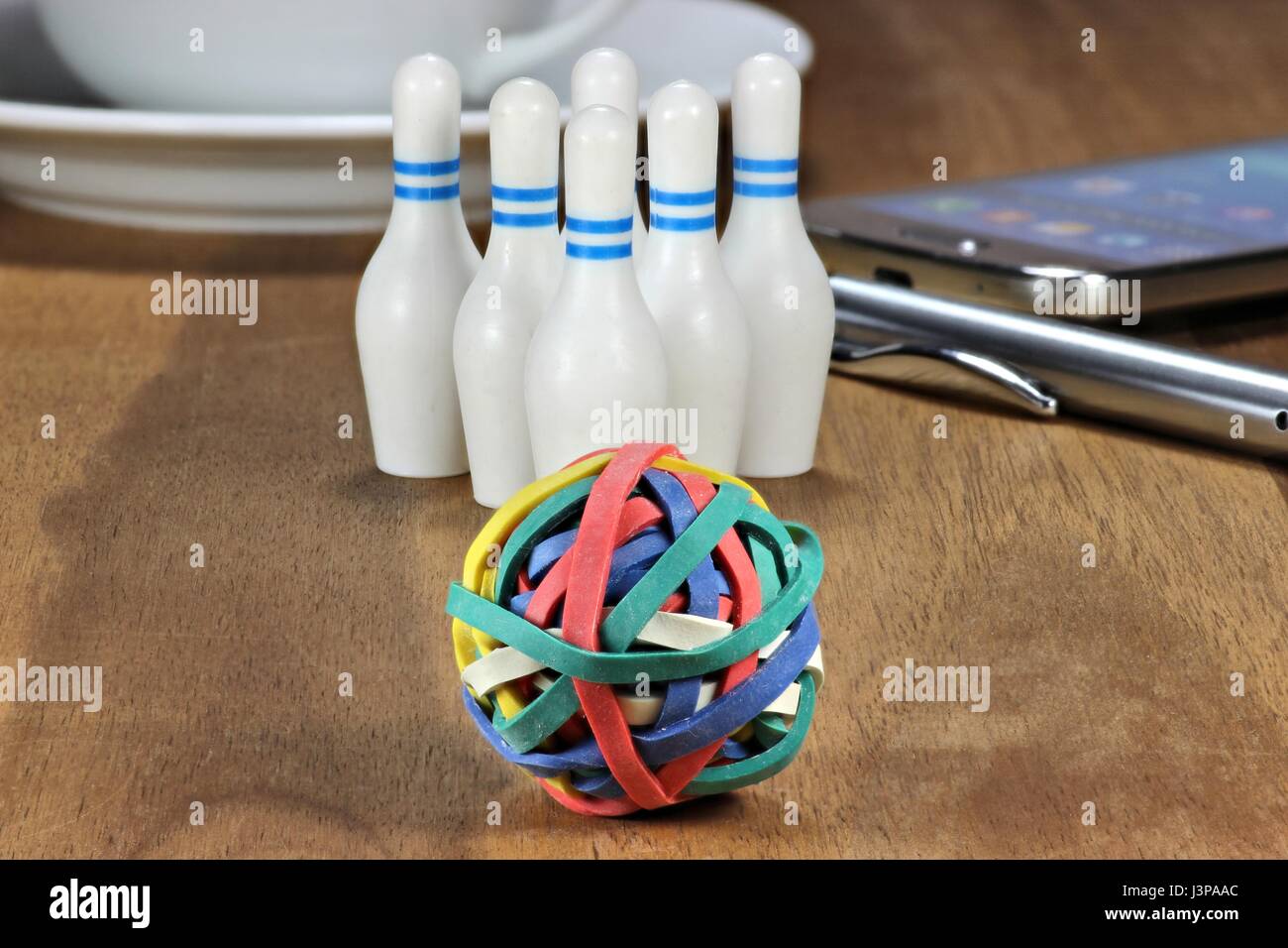 desk bowling with elastic bands ball Stock Photo - Alamy