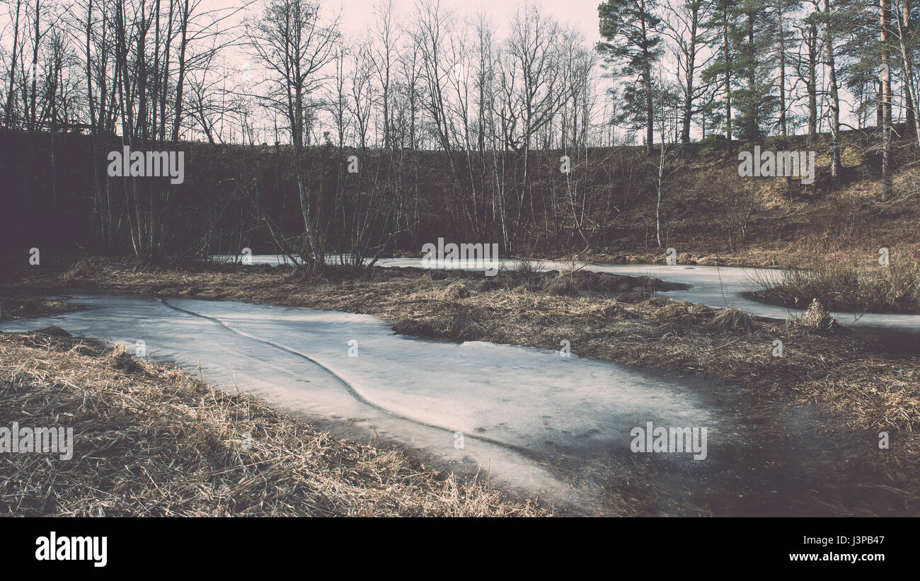 scenic spring colored river in country with trees and reflections ...