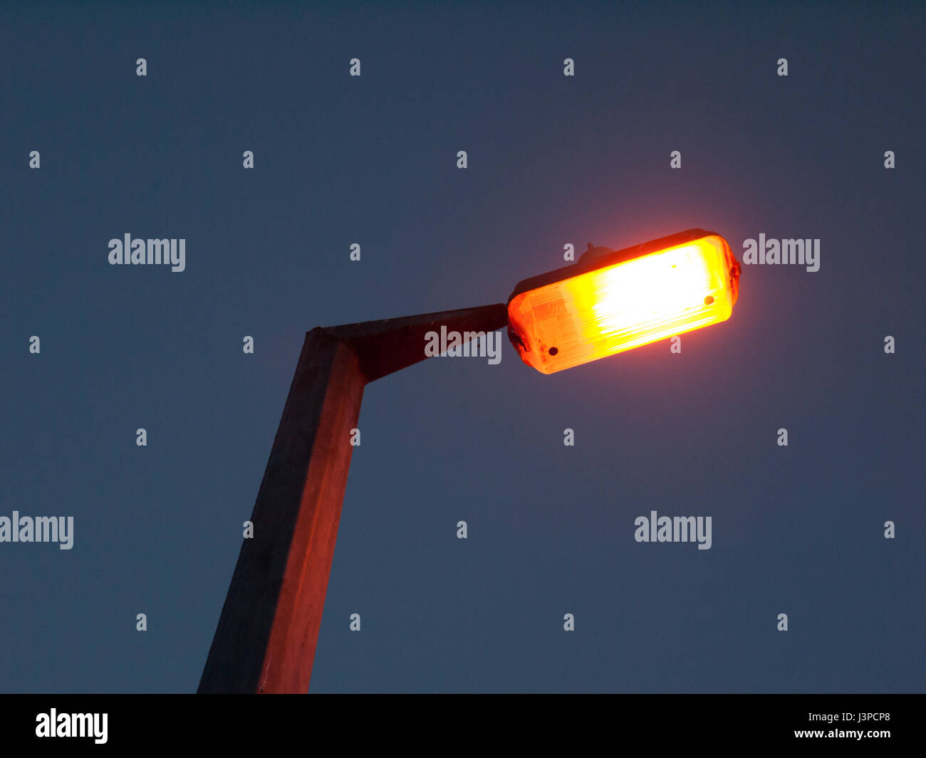 orange street light outside turning in the dark Stock Photo - Alamy