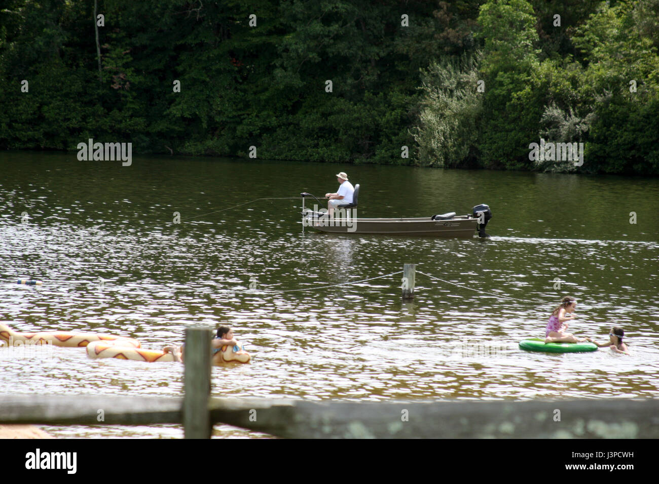 Fishing from a boat Stock Photo - Alamy
