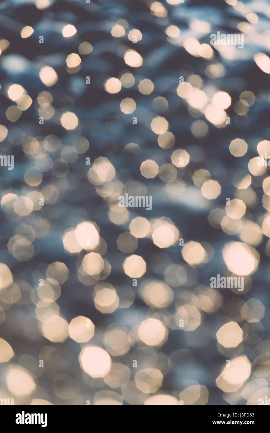 out of focus blur background with sea water in sunset light - retro ...