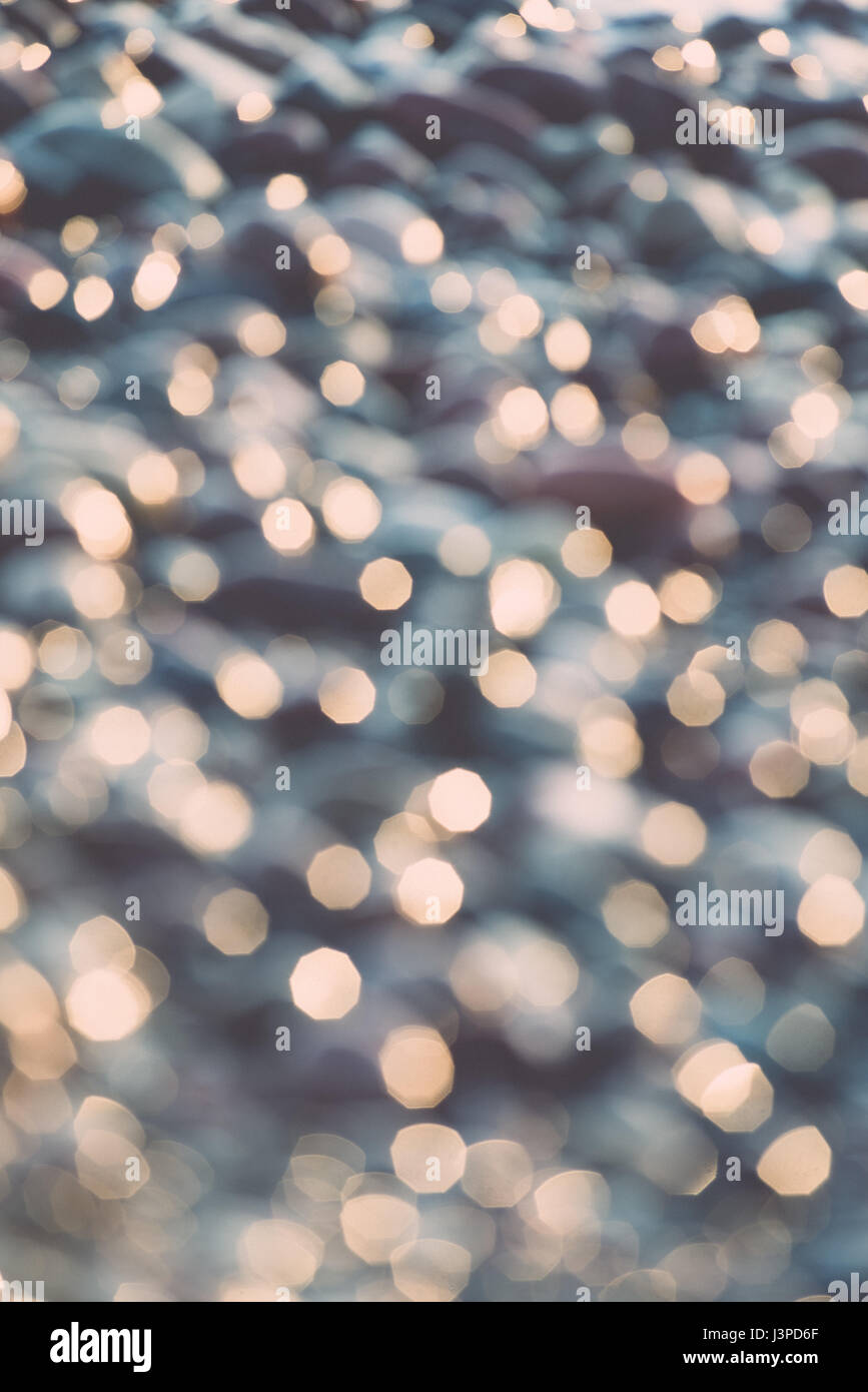 out of focus blur background with sea water in sunset light - retro ...