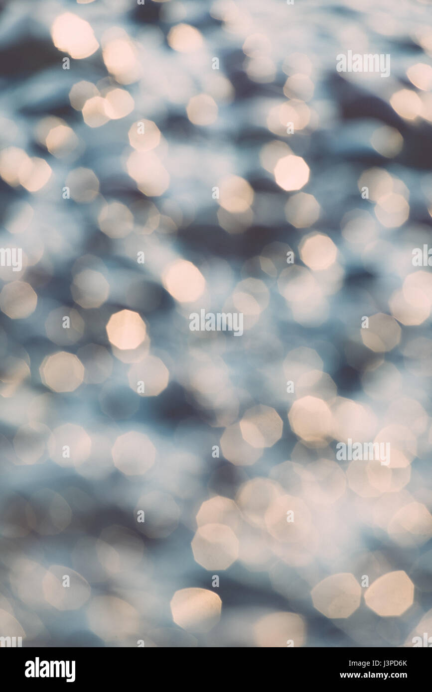 out of focus blur background with sea water in sunset light - retro ...