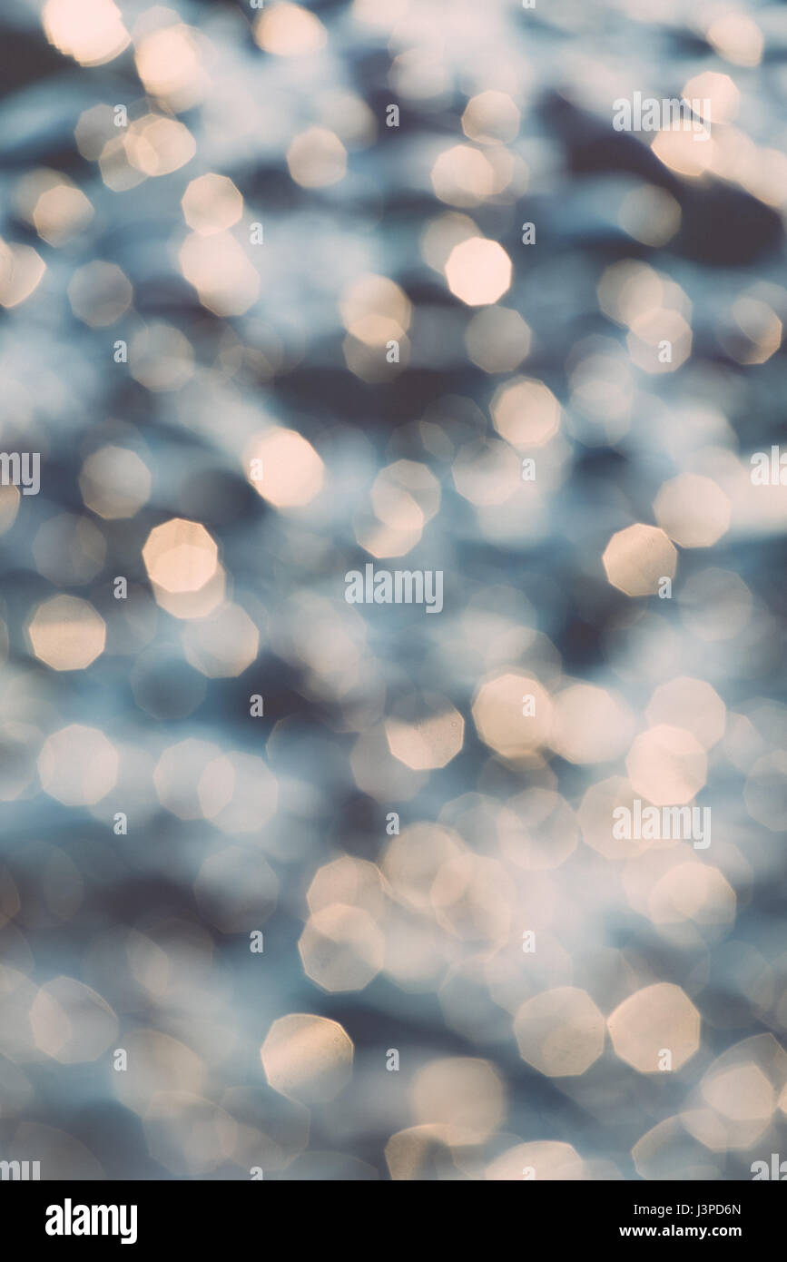 out of focus blur background with sea water in sunset light - retro ...