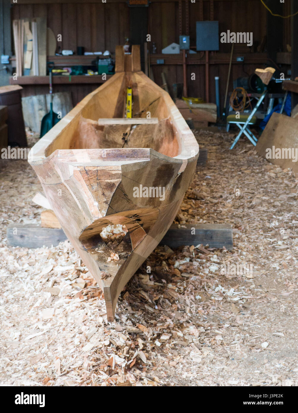 Artist carving a native canoe in Sitka, Alaska Stock Photo - Alamy