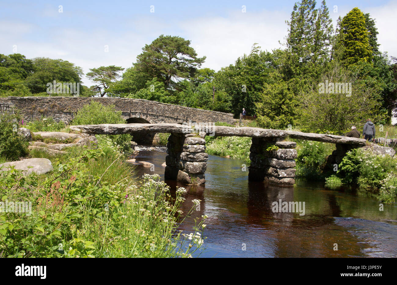 Historic Post Bridge over River Dart with modern humpback bridge behind ...