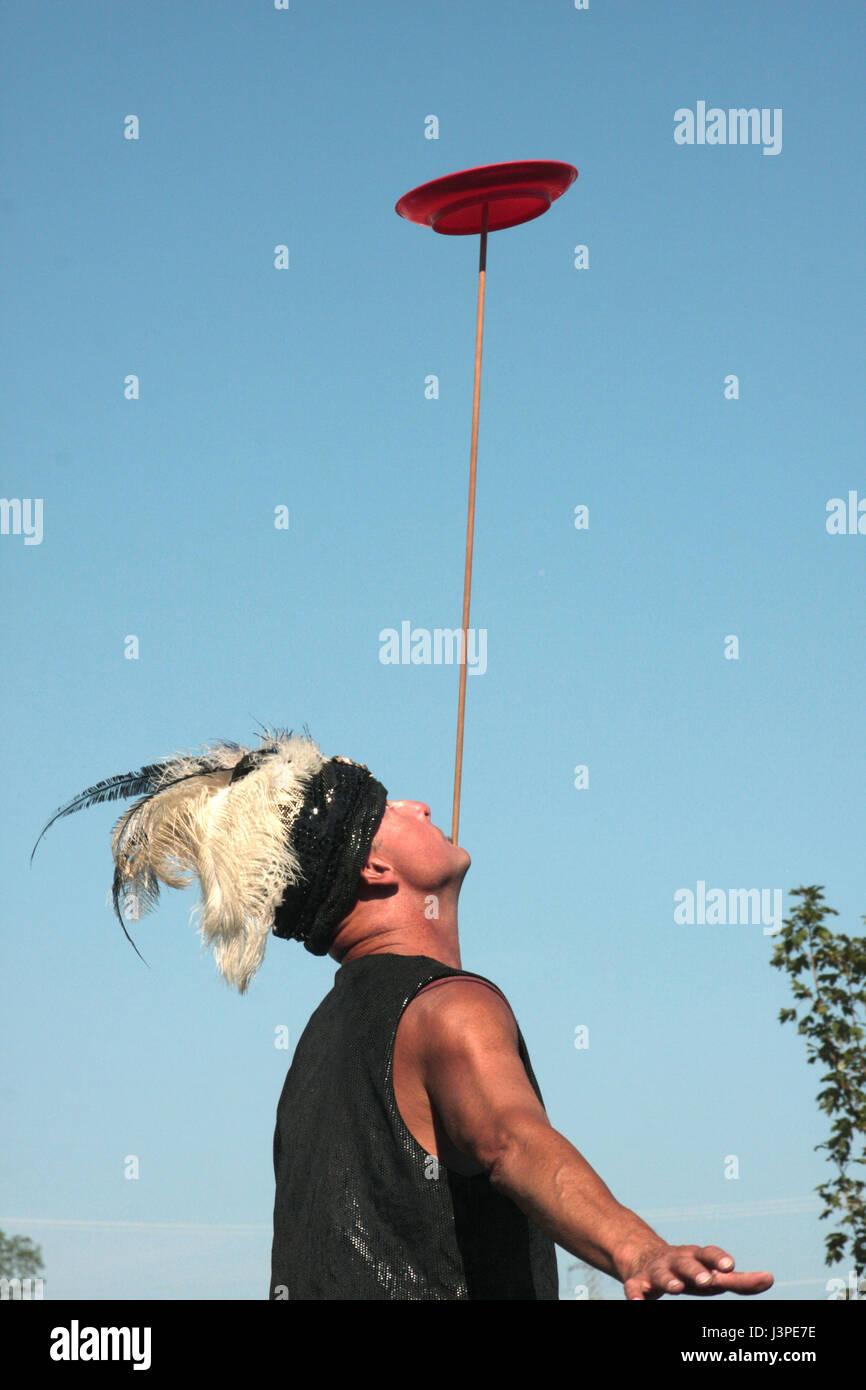 Man performing a balancing act Stock Photo - Alamy