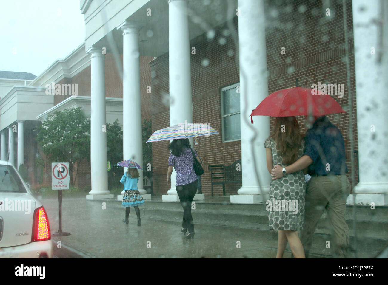 People with umbrellas walking in the rain Stock Photo - Alamy