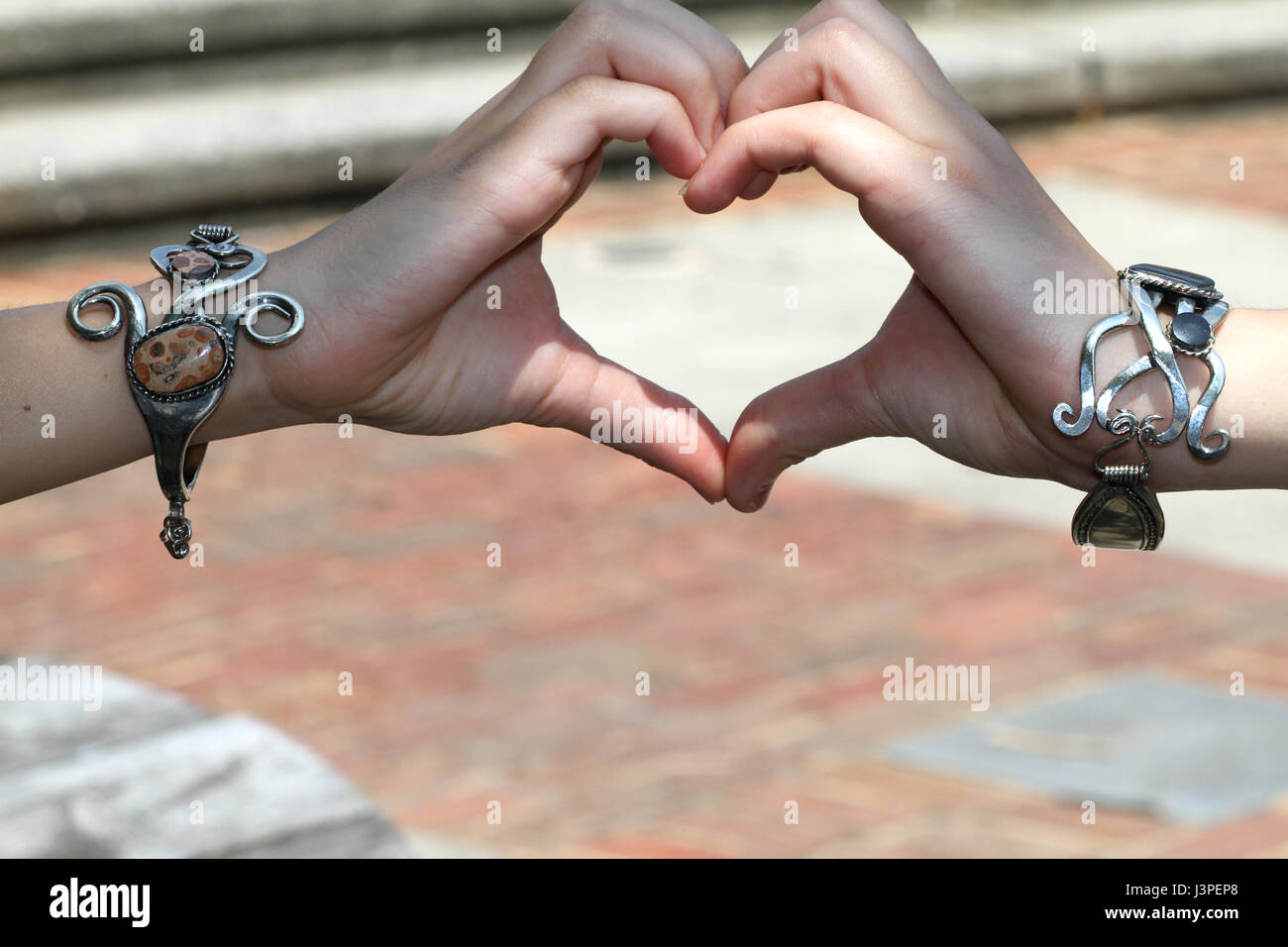 Friendship bracelets hands hi-res stock photography and images - Alamy