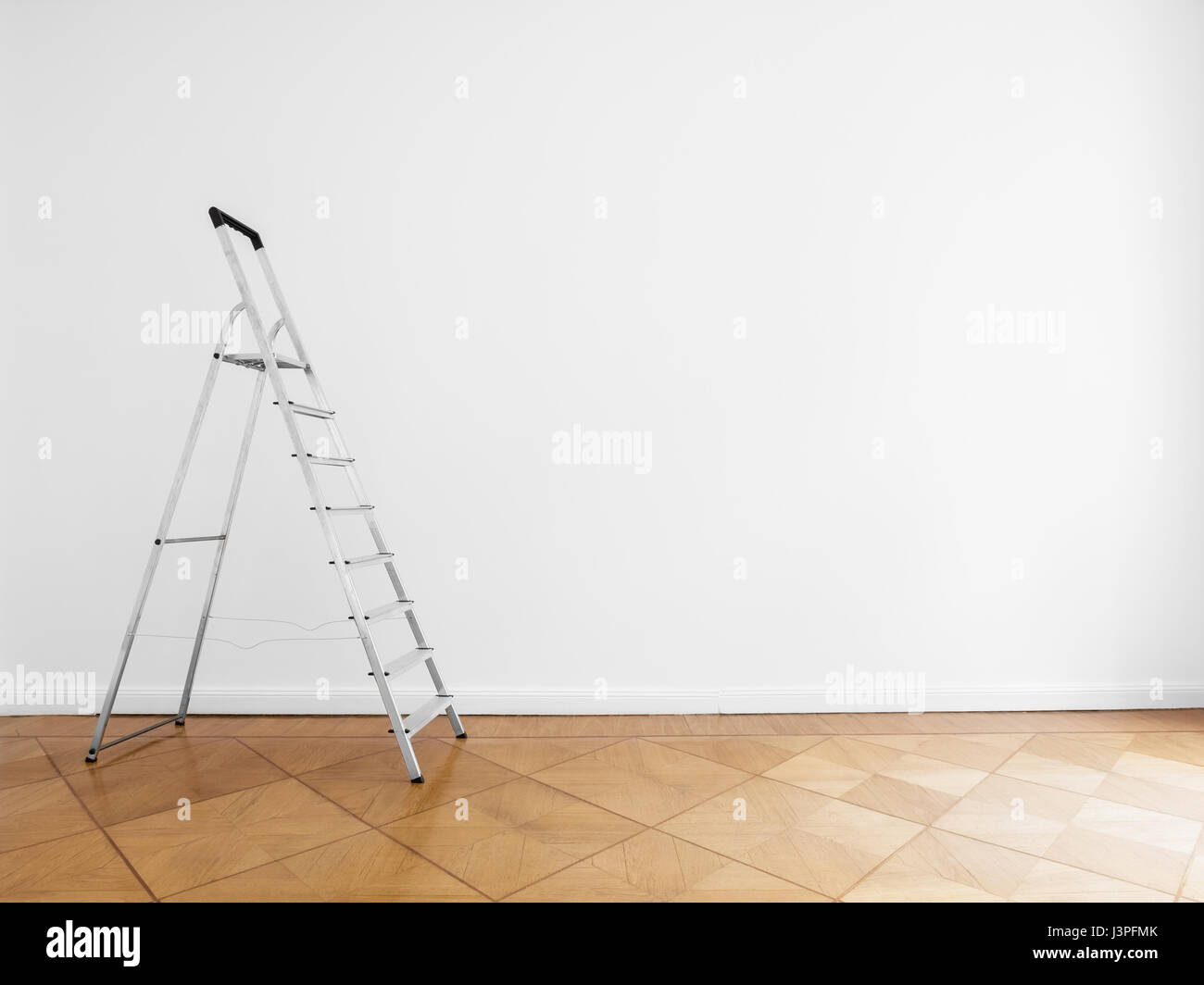 room with ladder and white wall background, renovated Stock Photo - Alamy
