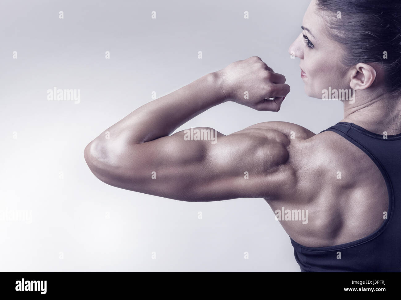 Athletic young woman showing the hand muscles Stock Photo - Alamy
